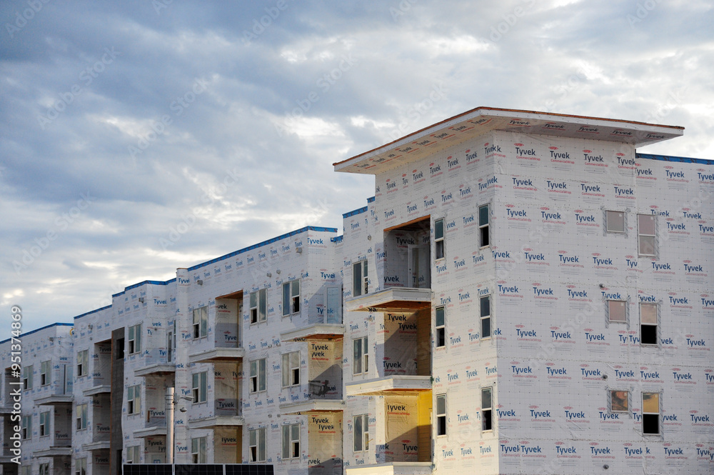 Exterior view of apartment complex buildings under construction ...