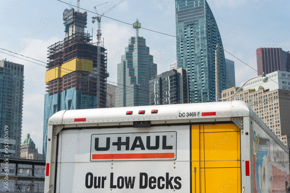 U-Haul rental truck (rear doors) parked on Cooper Street with a view of ...