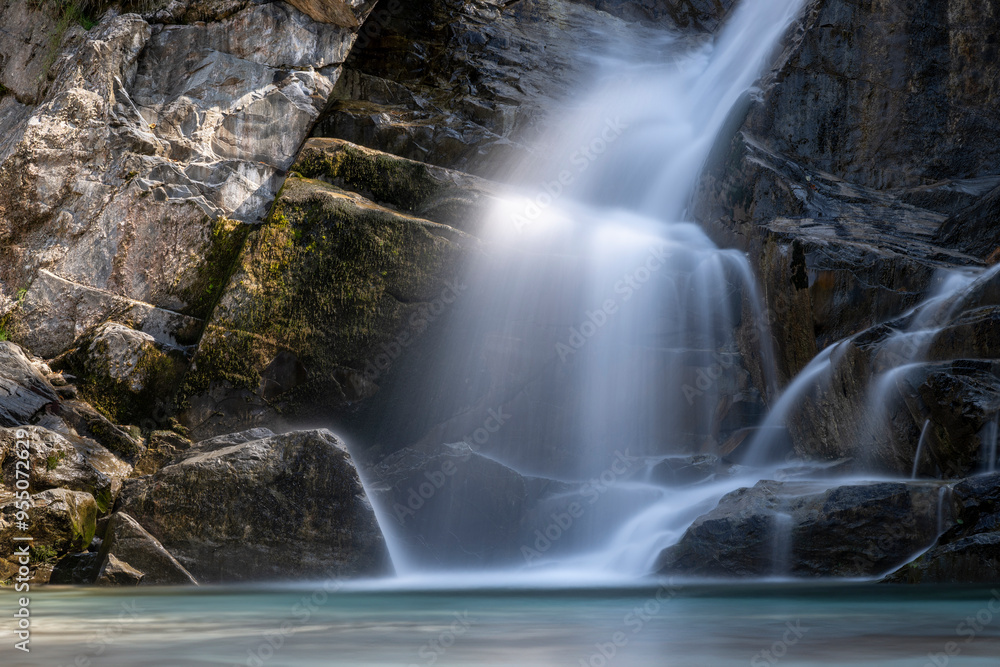 Water splashing on the rocks at the bottom of a waterfall. Waterfall ...