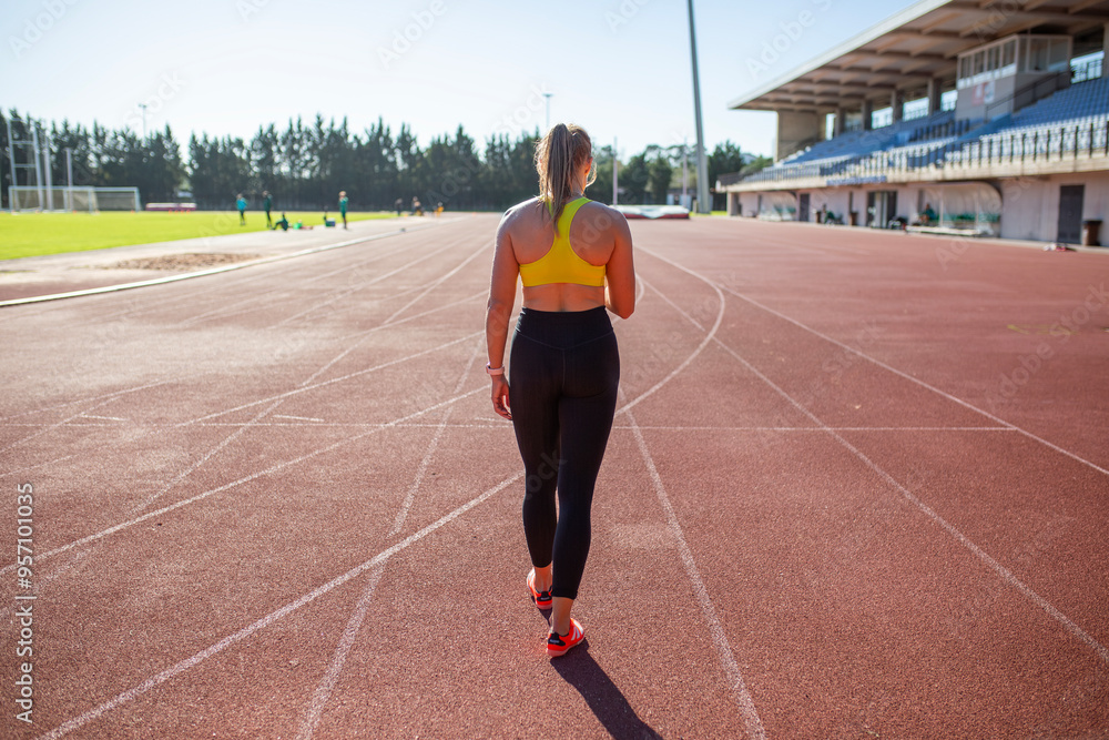 athletic girl training at the stadium Stock Photo | Adobe Stock