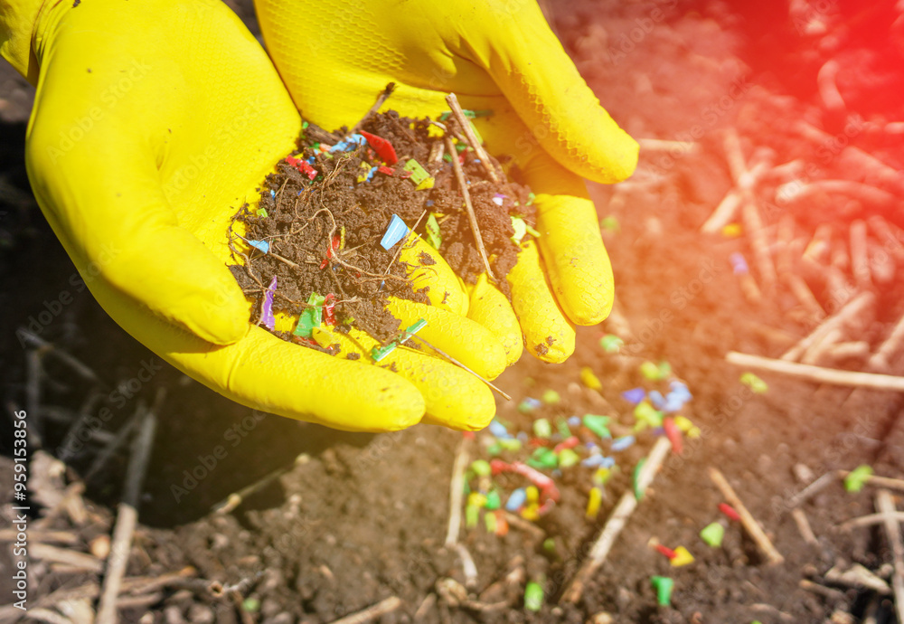 Microplastic pollution. Microplastics in ground. Soil contaminated with ...