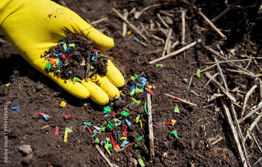Fotografie Microplastic pollution. Microplastics in ground. Soil ...