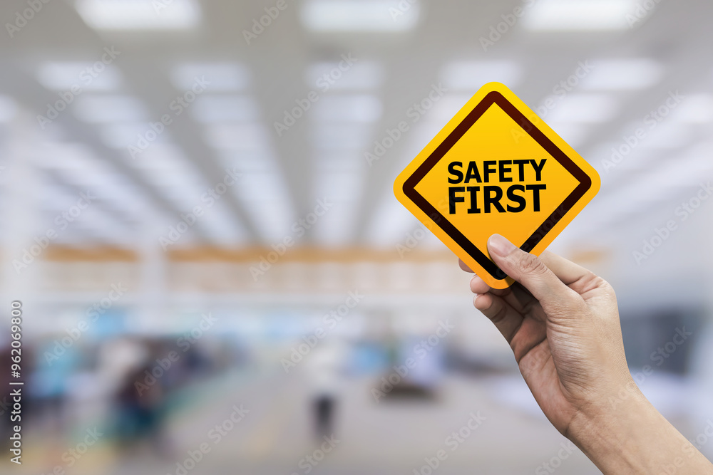 Hand holding safety first symbols for work safety, Safety first concept ...