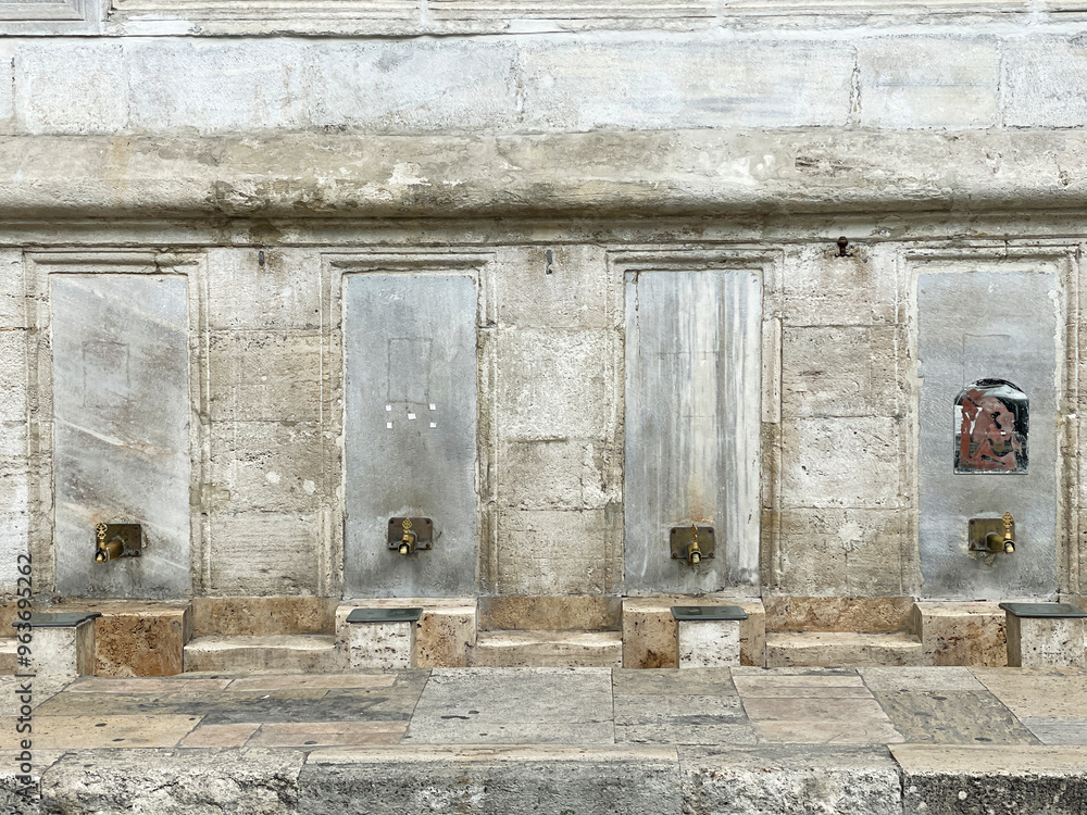 Historical stone water fountains with brass taps and stone basins for ...