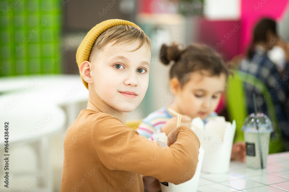 Kids child boy and girl eating ramen noodle wok with chopsticks in food ...