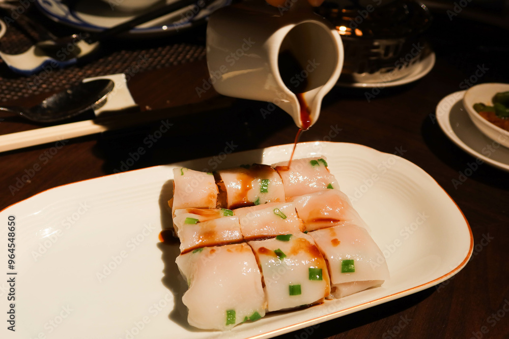 close up of Cantonese Hong Kong dim sum steamed rice roll with shrimp ...
