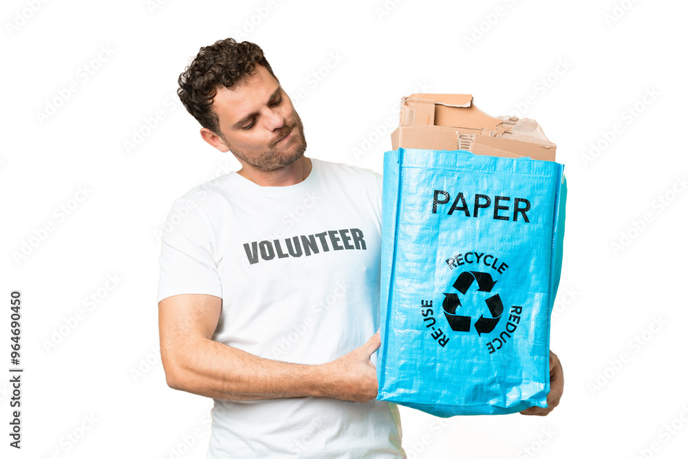 Brazilian man holding a recycling bag full of paper to recycle over ...