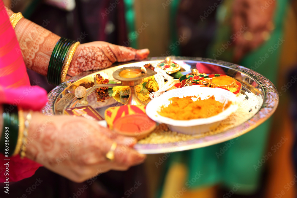 Indian pooja thali is a decorated plate used for rituals, containing a ...