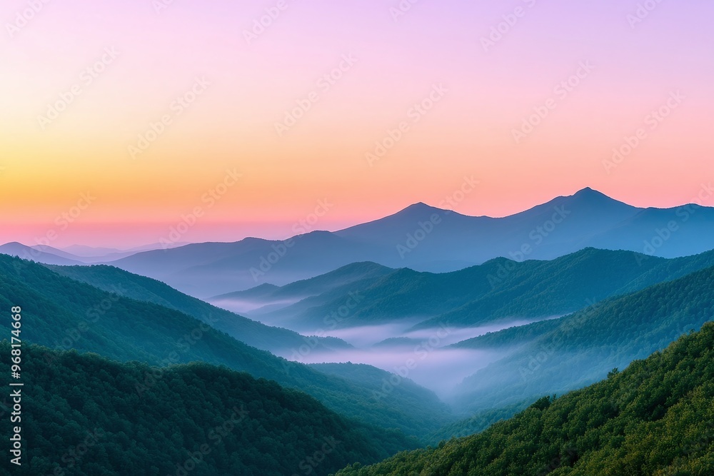 Beautiful sunset over mountain ranges with a misty valley below. Ideal ...