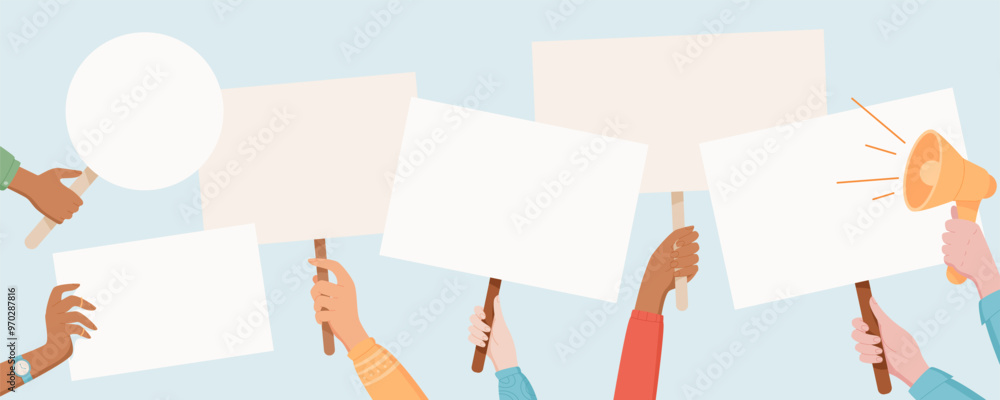 Protest signs are held high by a diverse hands. People raise placards ...