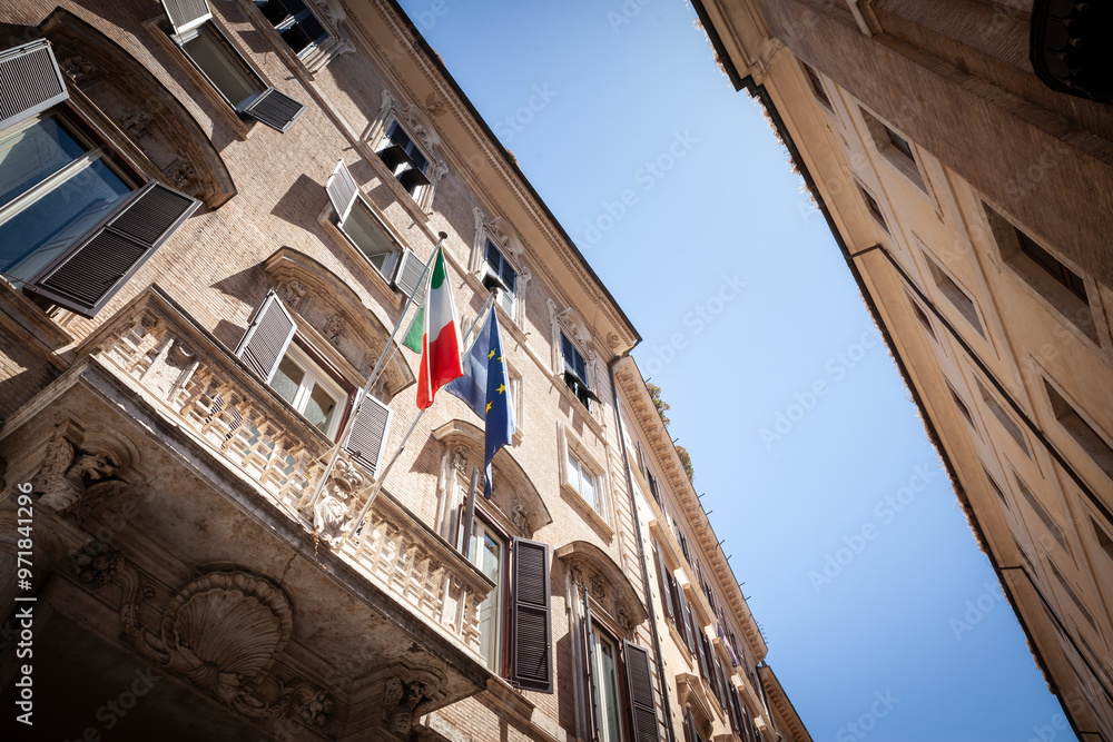 Italian & European Union flags in a typical narrow street in old Rome ...