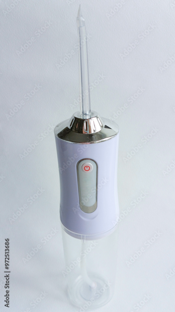 Dental irrigator on a white background close-up. Oral hygiene ...