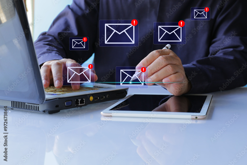Email Spam concept. Person use computer and tablet with virtual screen ...