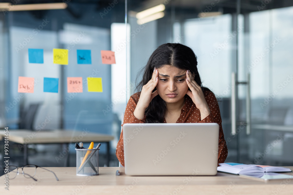 Upset and tired woman sitting at workplace inside office, business ...