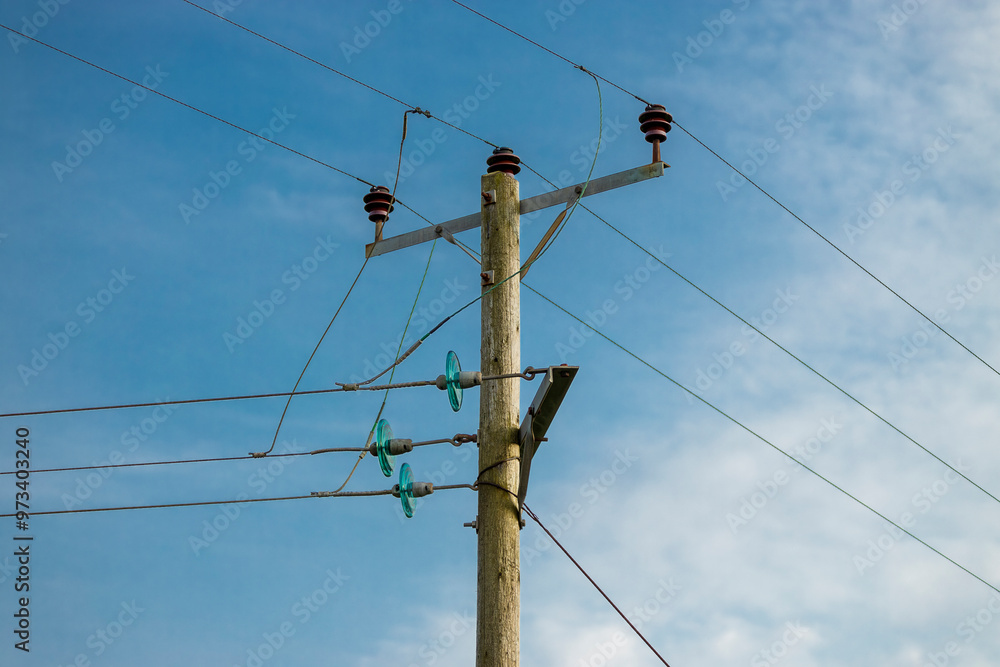 Wood telegraph pole with electricity power distribution lines and ...