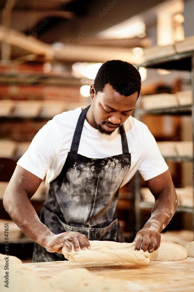 Male person, work and baking bread in kitchen as small business or ...