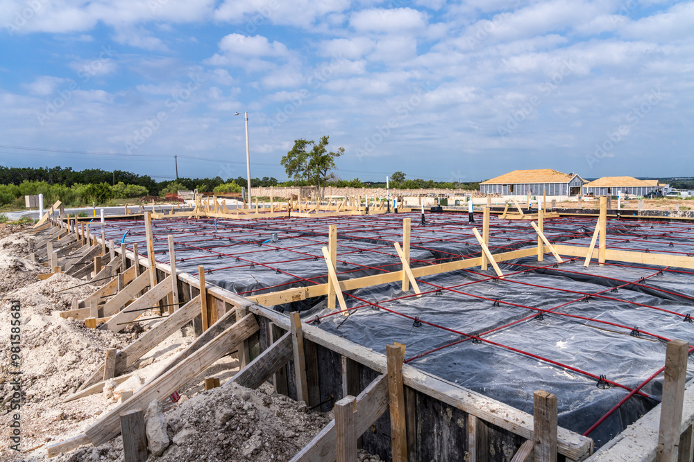 Trenches in the sand for plumbing and drain pipework with waterproofing ...