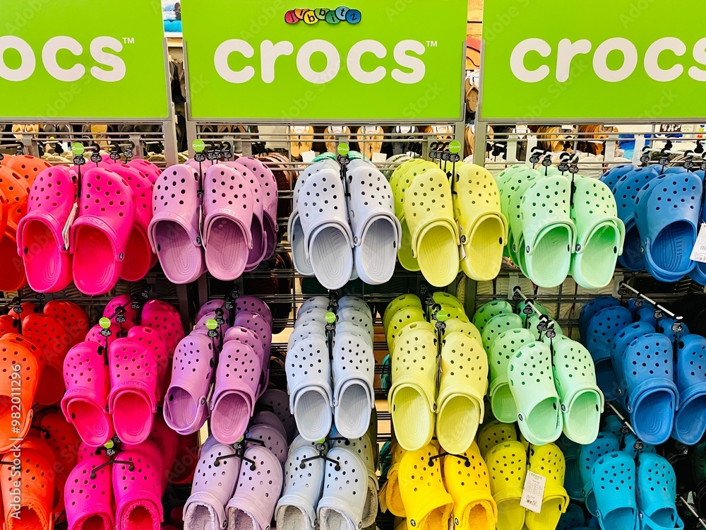 Popular Crocs brand foam clogs on display inside a shoe store. Stock ...