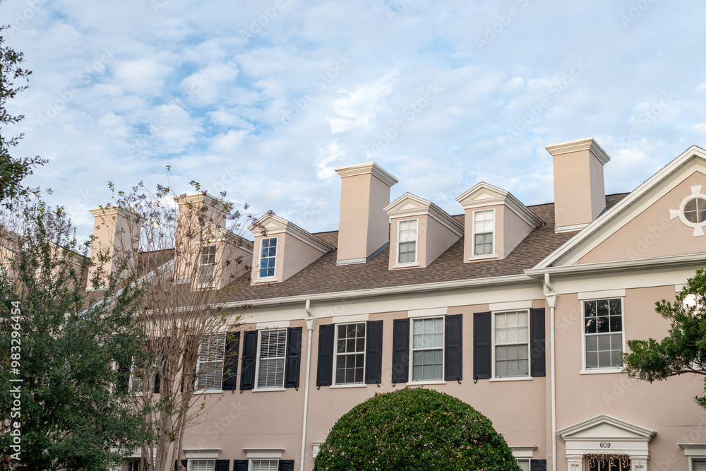 The exterior of a contemporary style row of residential three story ...