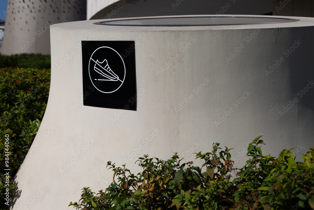 Sign prohibiting stepping on surface of decorative element in public ...