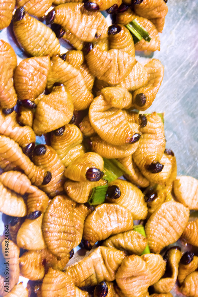 Larvae of woodworm beetles fried in a butter. Bit off the head with ...