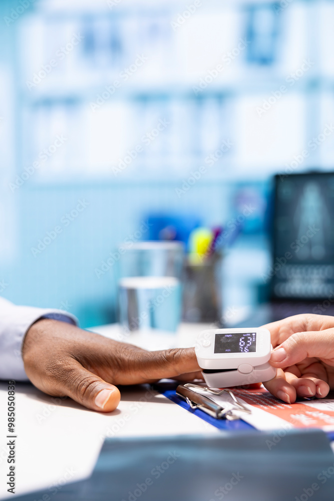 General practitioner taking the oxygen saturation measurement and ...