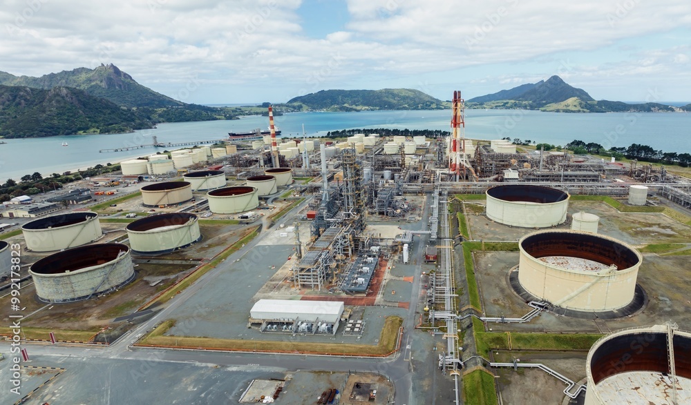 Chimney stacks and storage tanks at the decommisioned Marsden Point ...