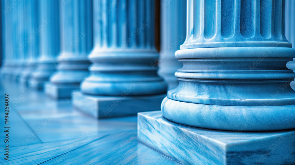 Elegant row of marble columns stands strong, captured in a cool blue ...