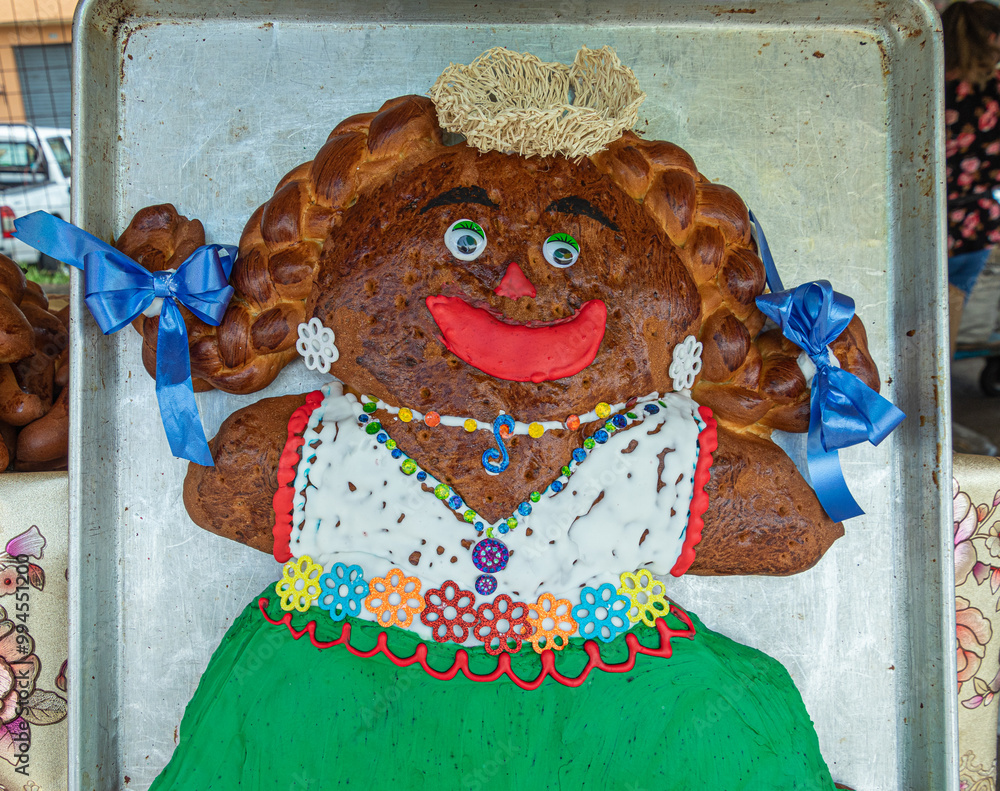 Large 'Guagua de pan' bread decorated as a chola cuencana in ...