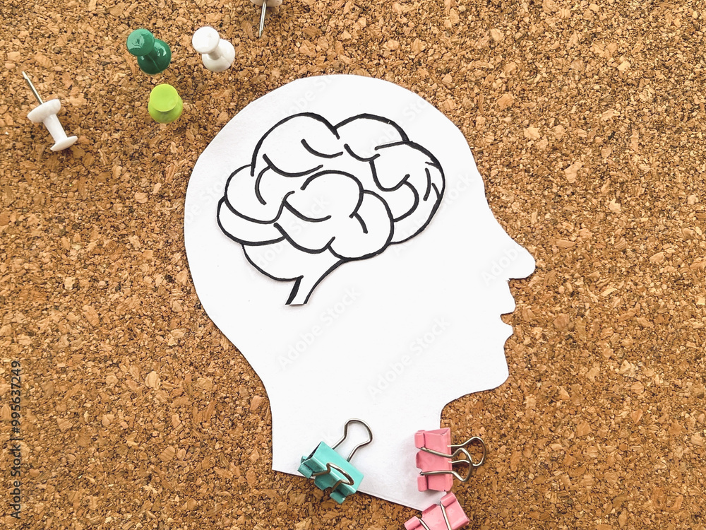 Health and medical care awareness concept. Cutouts of a human head and ...