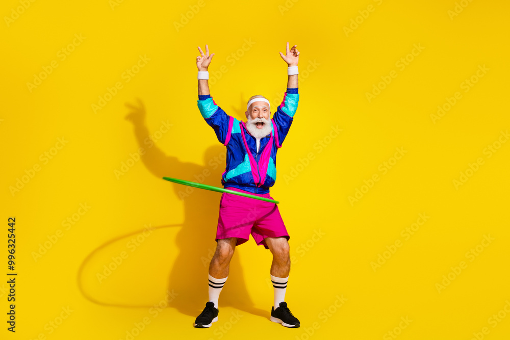 Full body portrait of eccentric aged man spinning hula hoop empty space ...