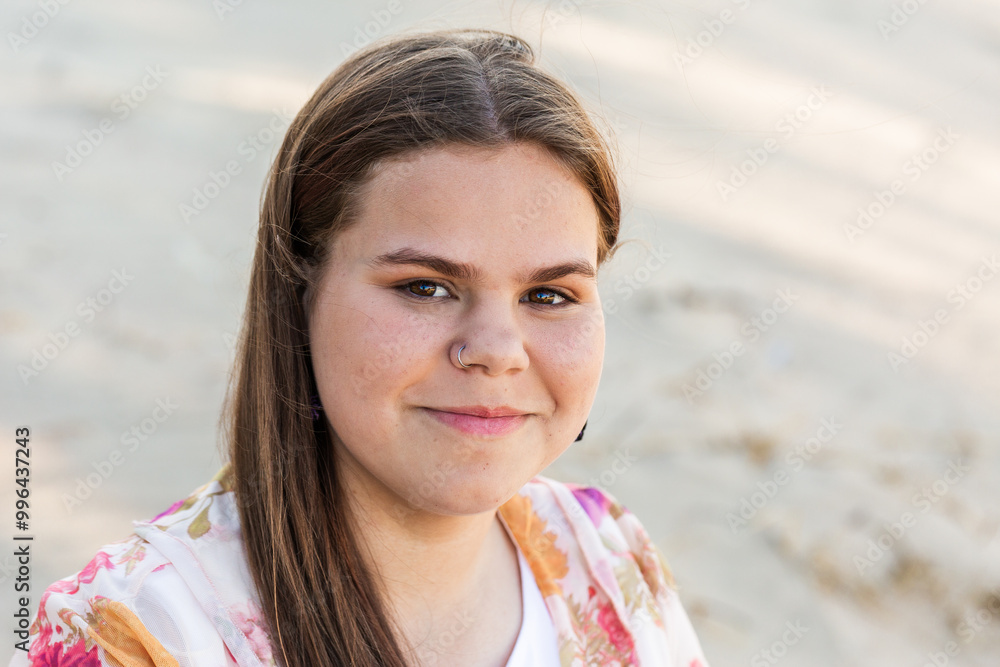 First Nations Australian Torres Strait Islander teen girl sitting on ...