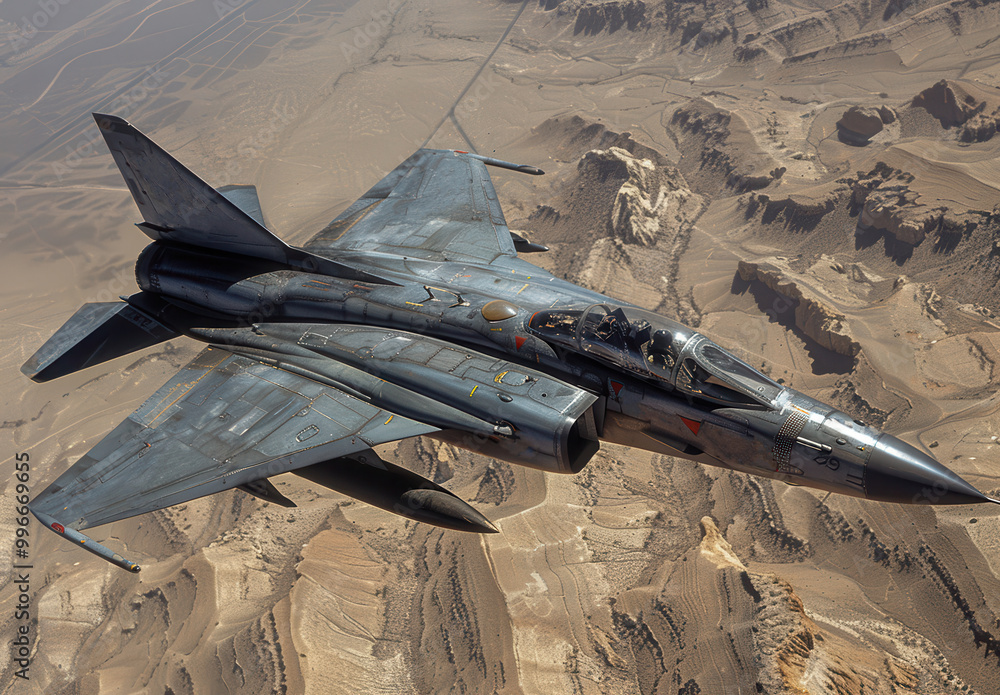 Military plane soaring over the desert landscape with visible fuel ...