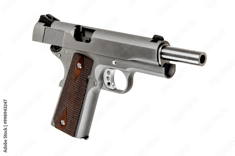 Silver pistol with a wooden handle. Short-barreled weapon. Modern semi ...