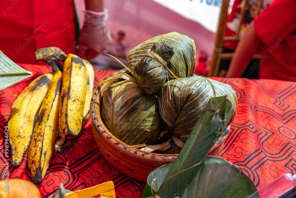Chicken juane wrapped in bijao leaves. Food, fruits and drinks of the ...