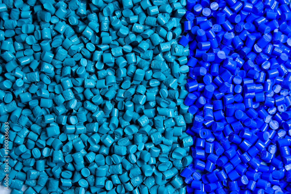 Blue and turquoise masterbatch granules on a white background, this ...