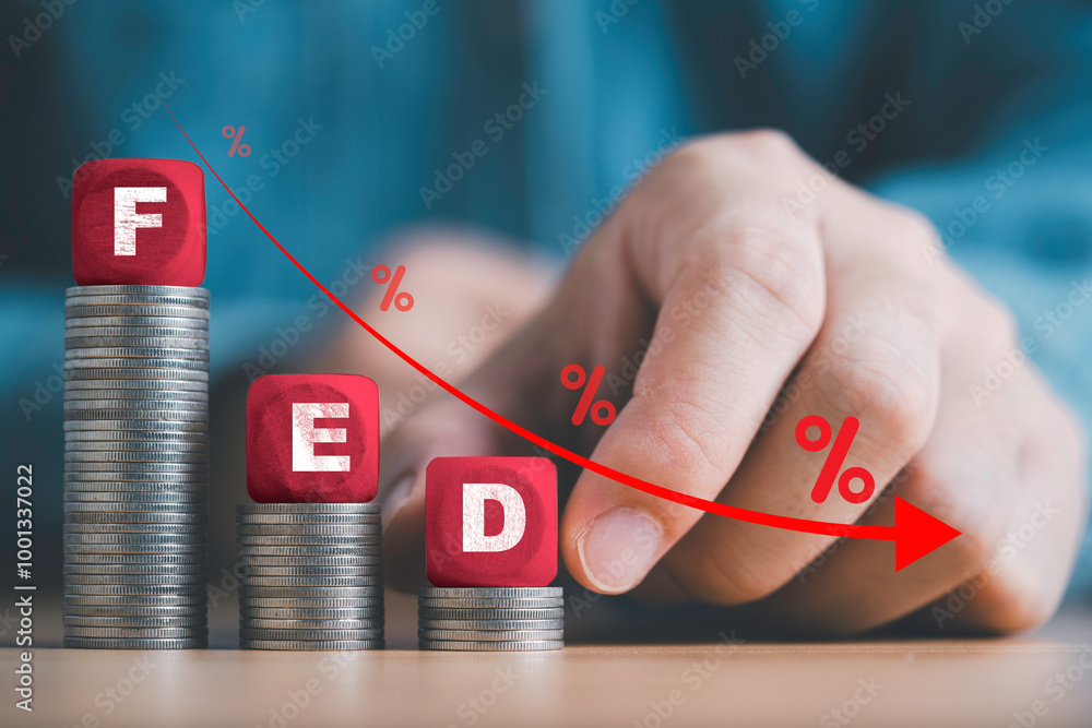 Businessman putting FED wording with down arrow and percentage sign for ...
