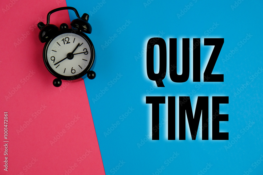 the words Its Quiz Time with laptop, white alarm clock and a cup of ...