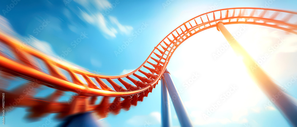 Roller coaster track soaring through a clear blue sky, evoking ...
