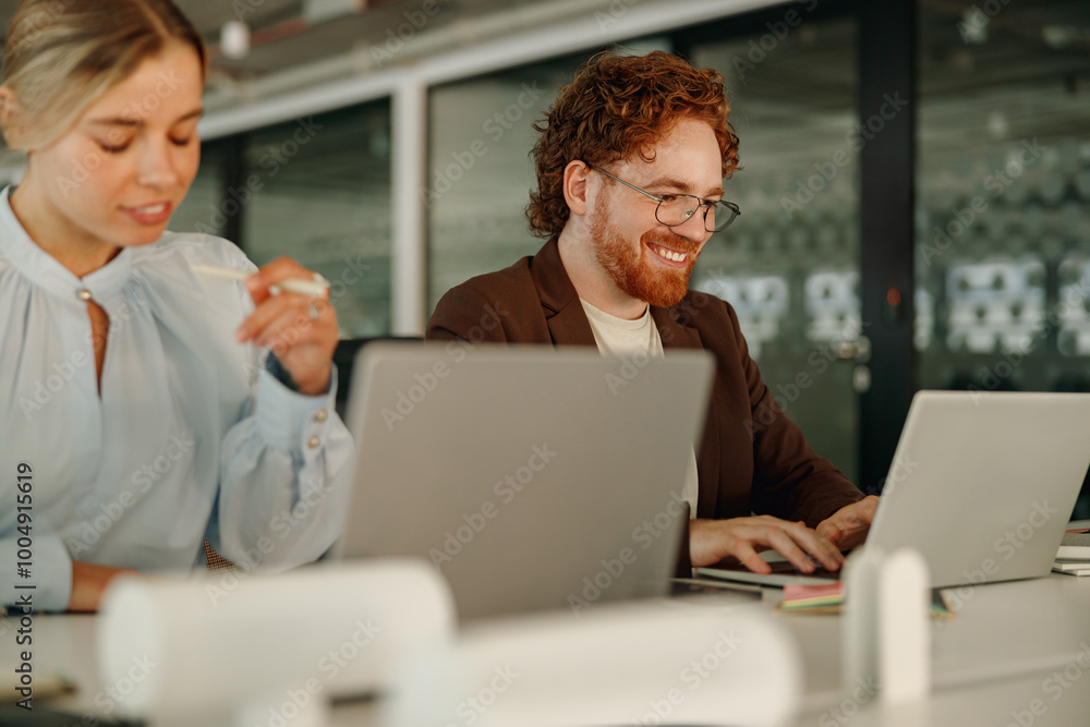 Two dedicated professionals are engaged in a highly productive and ...