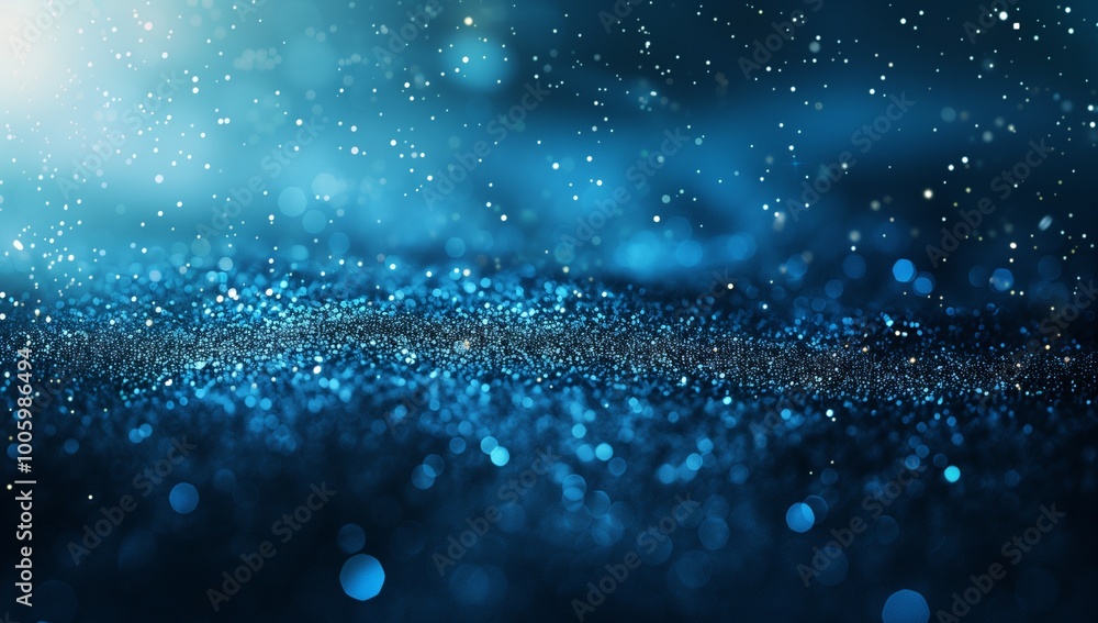 Abstract blue glitter background with bokeh lights and particles. Glittering night sky, dark ...