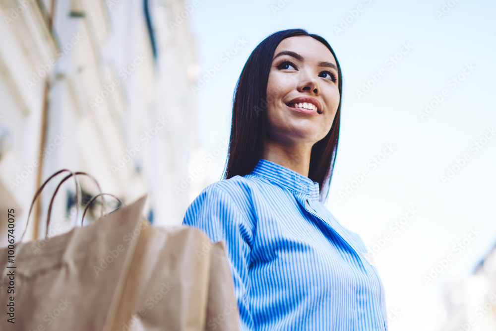 Happy millennial female shopaholic continue shopping online via laptop ...