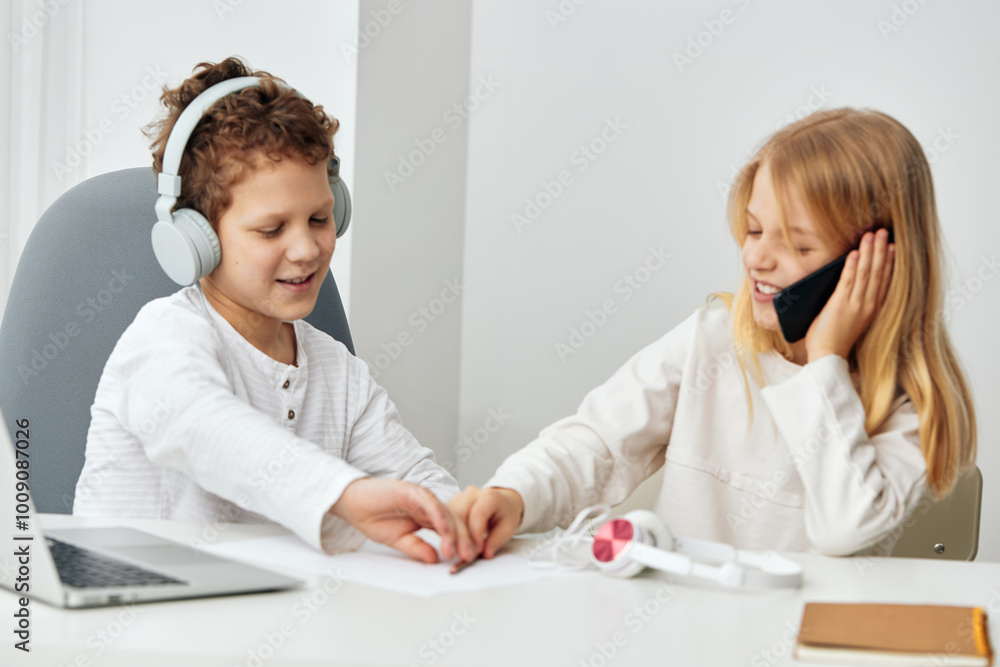 Foto de Stock Happy children using laptops for online studying in their ...