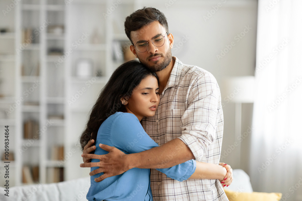 Loving indian man hugging, comforting and supporting his wife feeling ...