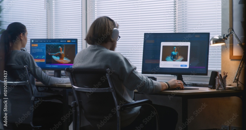 Back view of team of workers using AI generator on computers in office. PC screens showing ...
