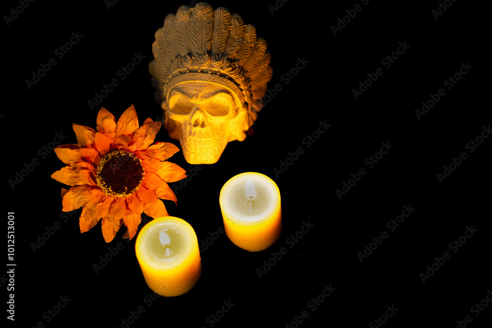 All Souls' Day: altar with a flower, skull and candles on a black ...
