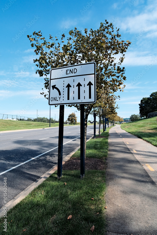 Street signs indicating traffic flow for a multi-lane road. Stock Photo ...