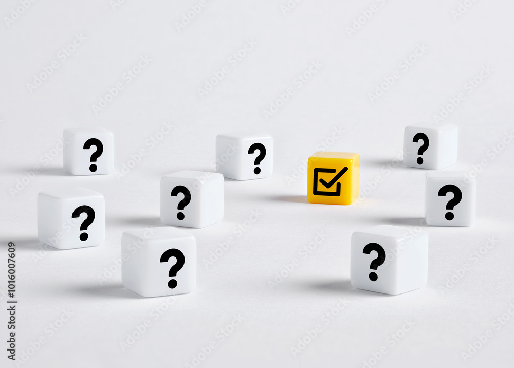 Yellow check mark cube surrounded by question mark cubes Stock Photo ...