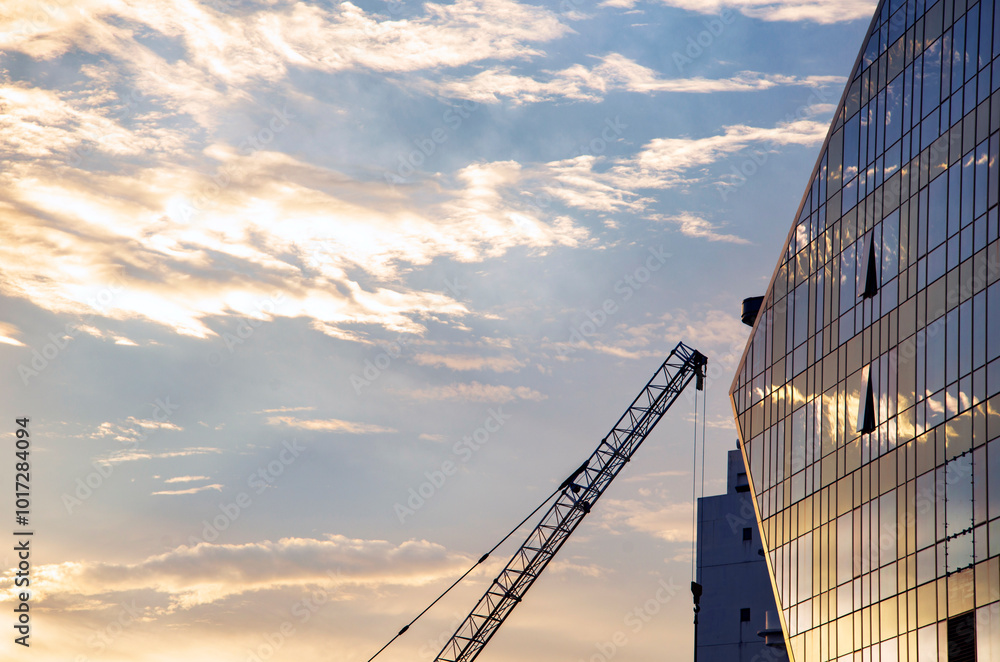 Sunset light reflecting off a modern skyscraper,in downtown Manila ...