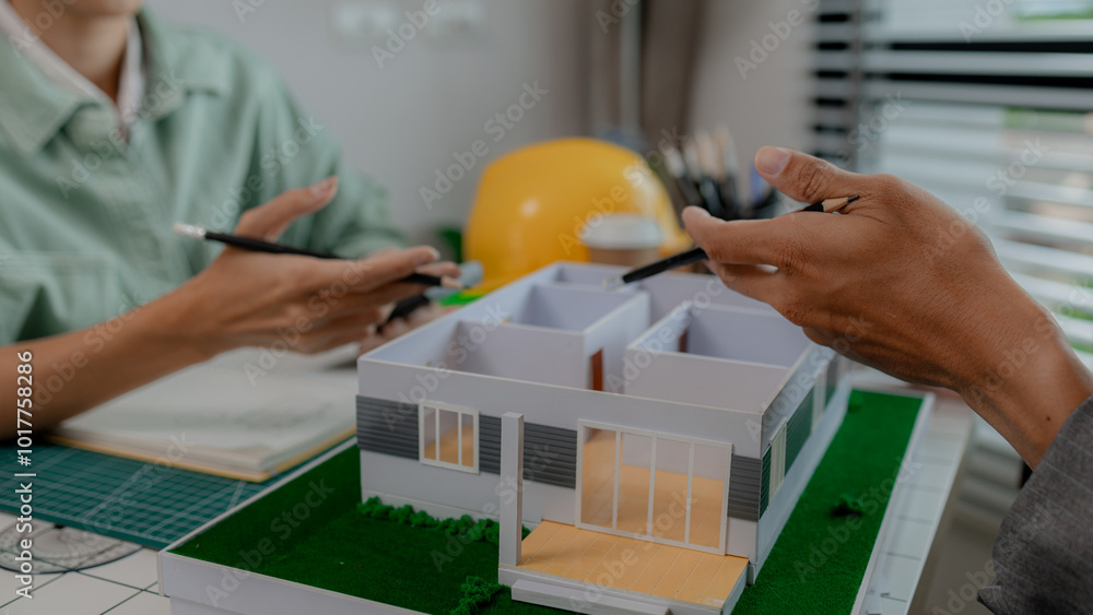 engineer and investor are negotiating the details of a housing project ...